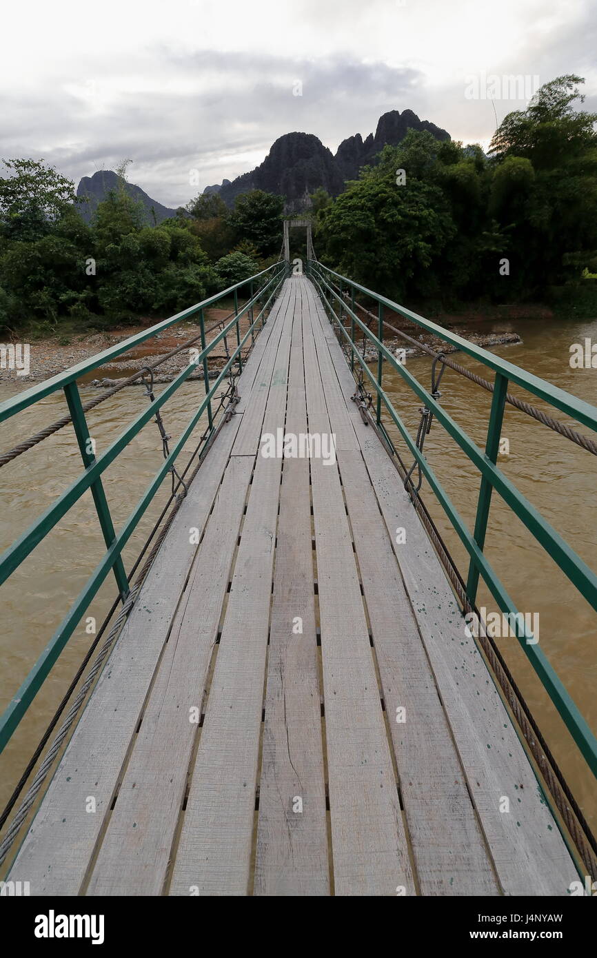 Wooden planking and metal bannister of no way out footbridge crossing ...