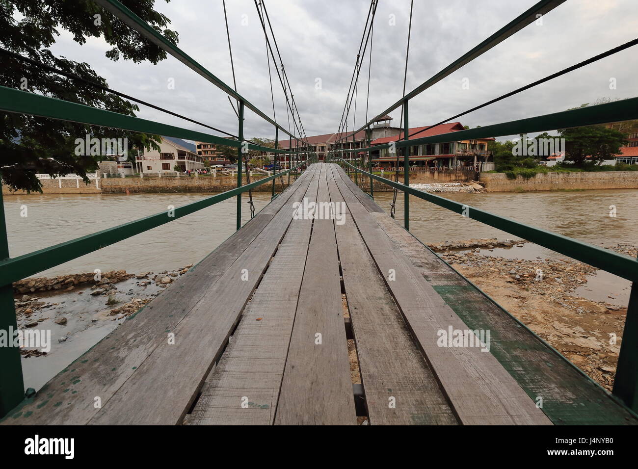 Wooden planking and metal bannister of no way out footbridge crossing ...