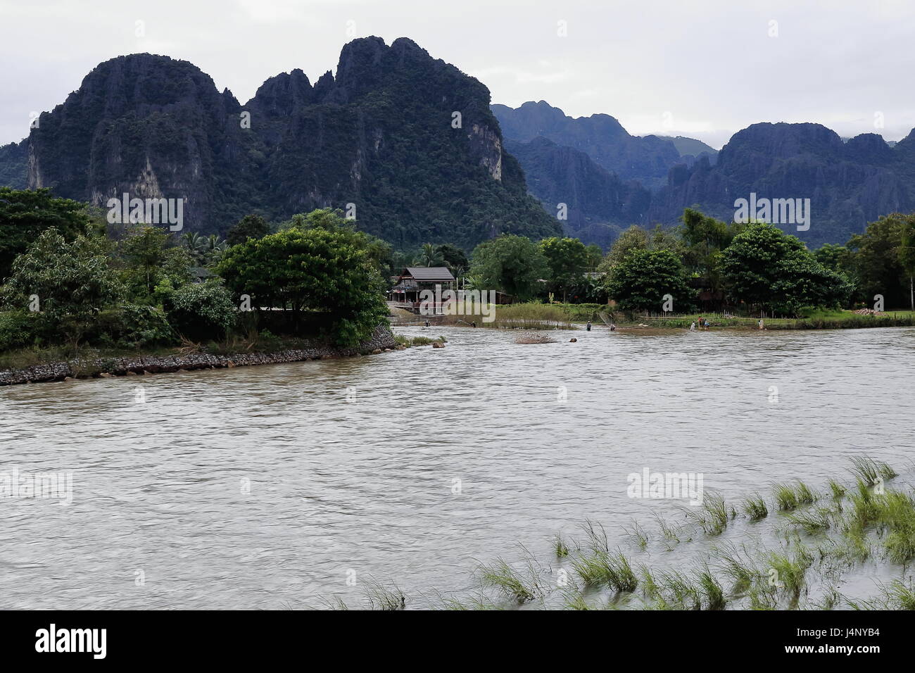 Karst landscape of rugged hills and cliffs-right or west bank of Nam ...
