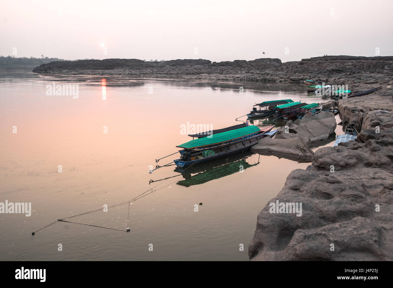 Longtail boat, Berth at sand Sam Pan Bok Grand Canyon in Maekhong river ...
