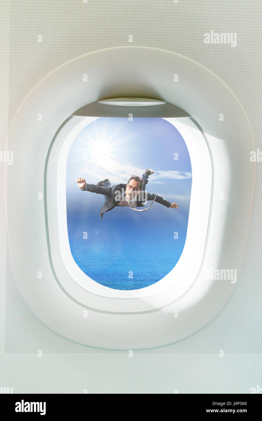 business man floating mid air out side passenger plane window Stock ...