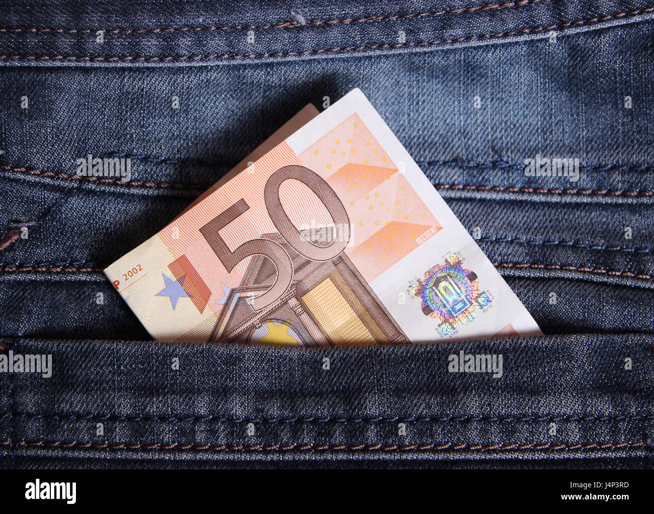 Euro in a pocket Stock Photo - Alamy