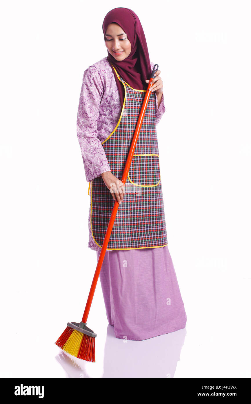 Beautiful housewife wear an apron hold cleaning equipment isolated on ...
