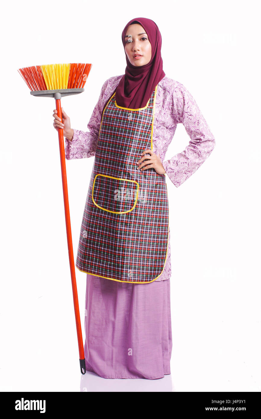 Beautiful housewife wear an apron hold cleaning equipment isolated on ...