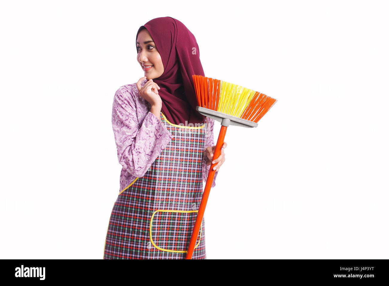 Beautiful housewife wear an apron hold cleaning equipment isolated on ...