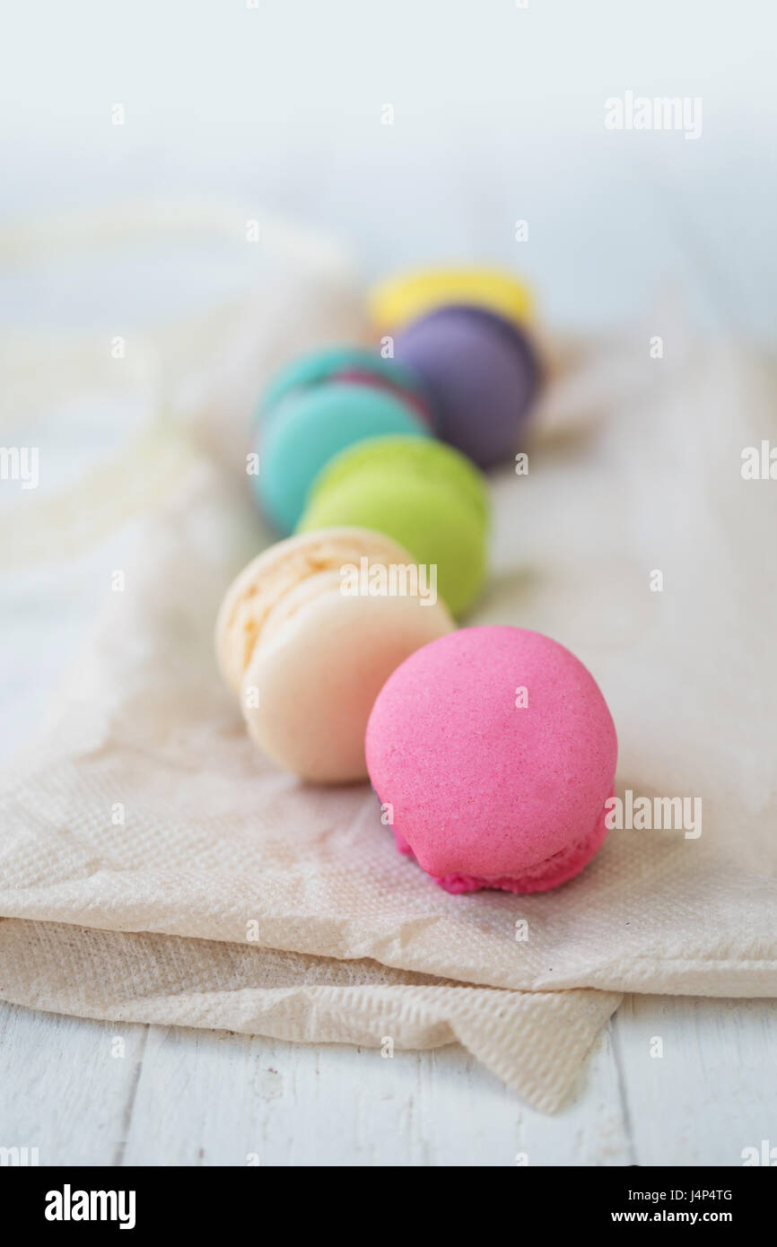 Colorful macaroon set on white wood background Stock Photo - Alamy