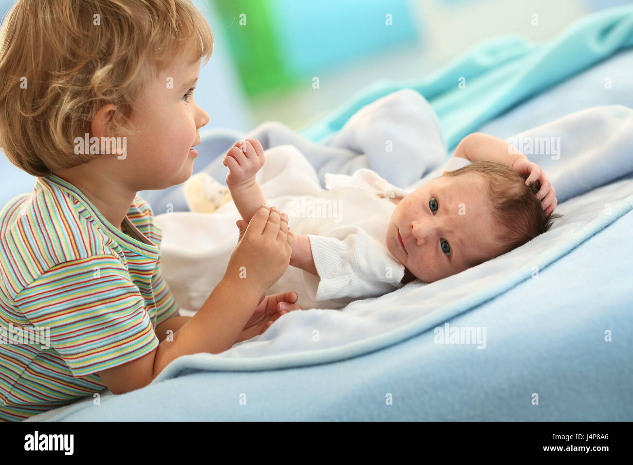 Siblings, baby, 1 month, back position, boy, 3 years, abdominal ...