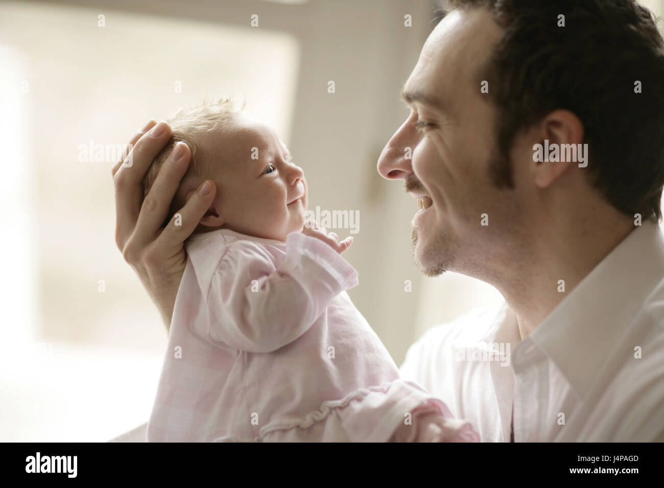 Father with baby, tread, model released Stock Photo - Alamy