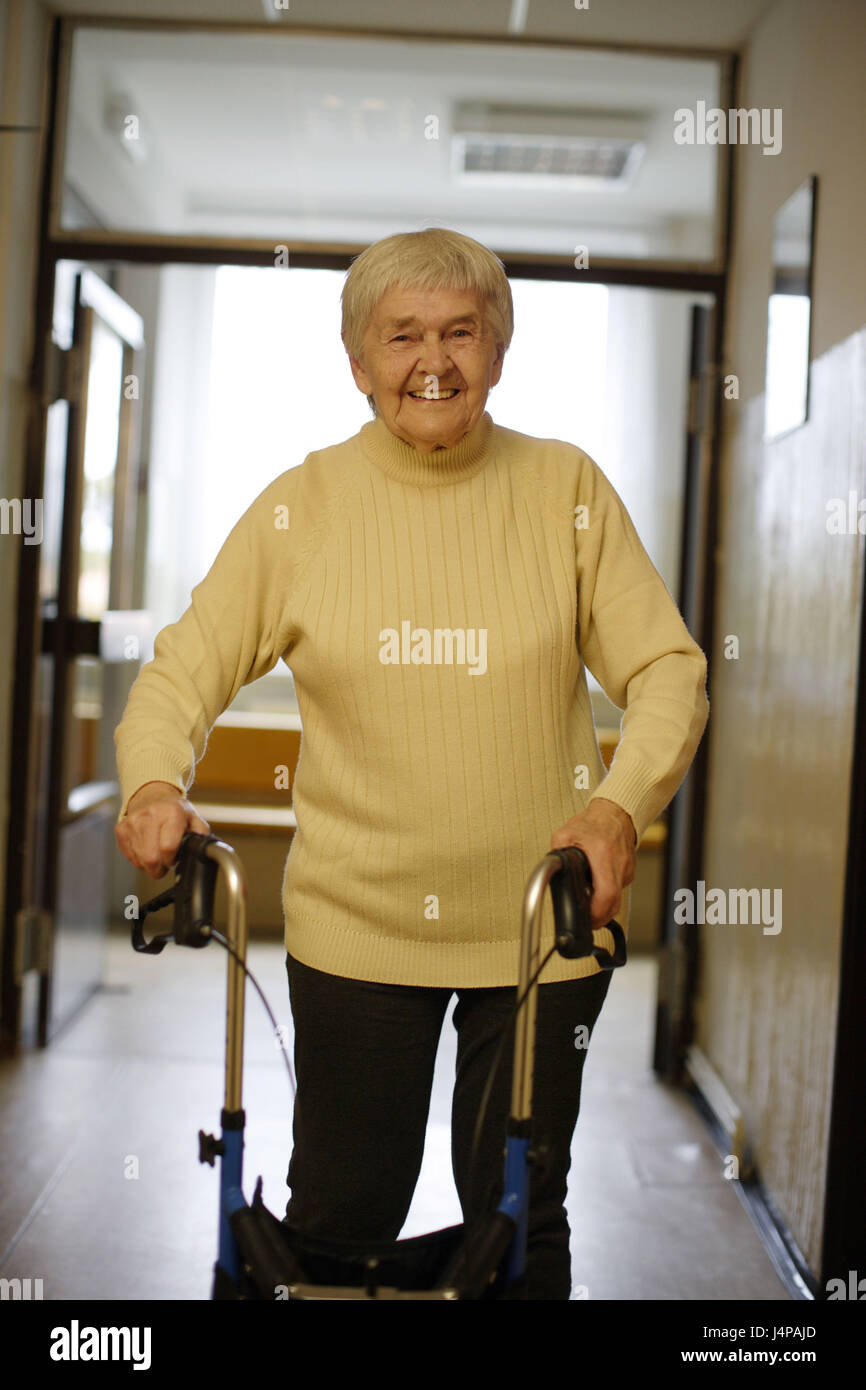 Nursing home, senior, smile, Rollator, model released Stock Photo - Alamy