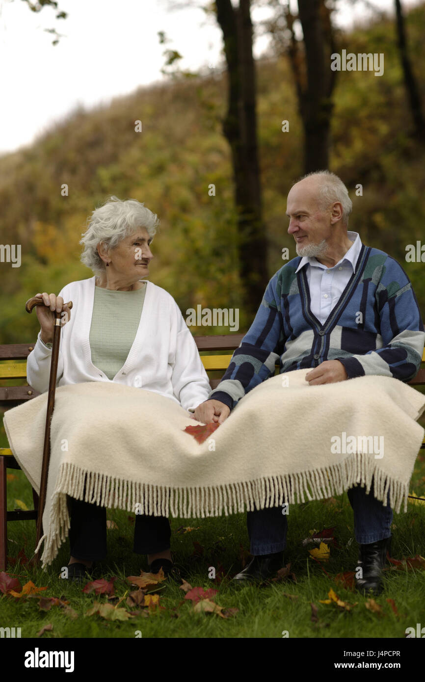 Senior citizen's couple, park-bench, sit, caps, model released Stock ...