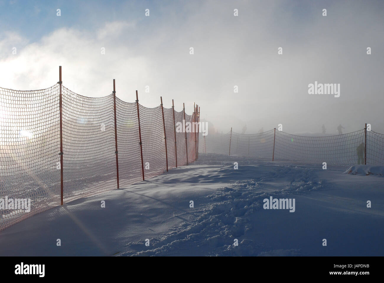 Ski runway, fresh snowfall, catch fences, fog patches, back light Stock ...