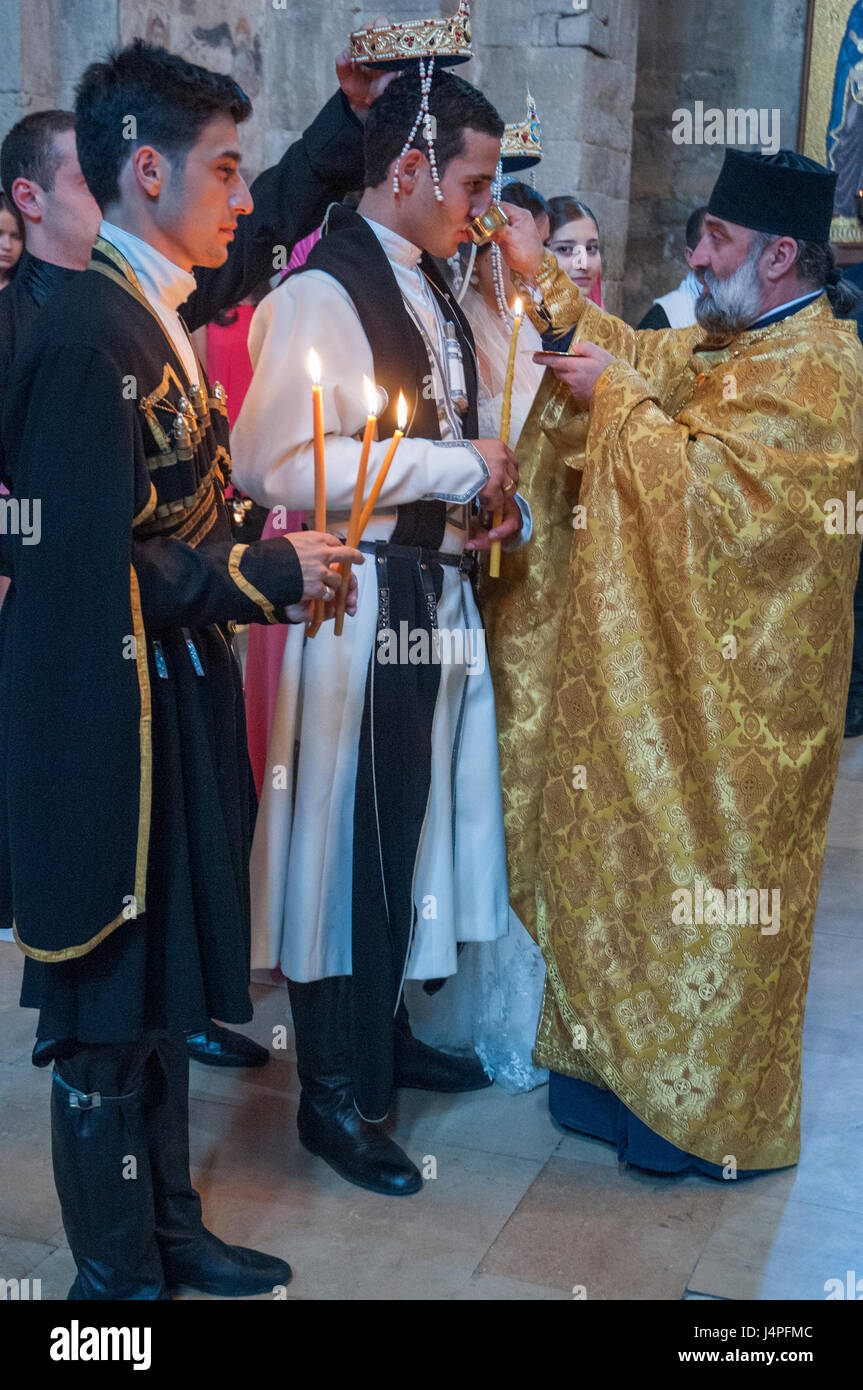 Georgian priest performing a wedding ceremony at the 11th-century ...