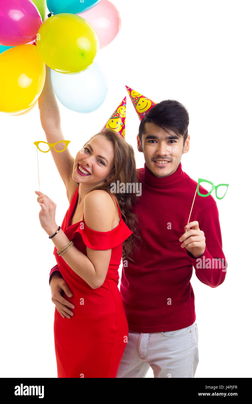 Young elegant woman with long chestnut hair in red dress and young ...