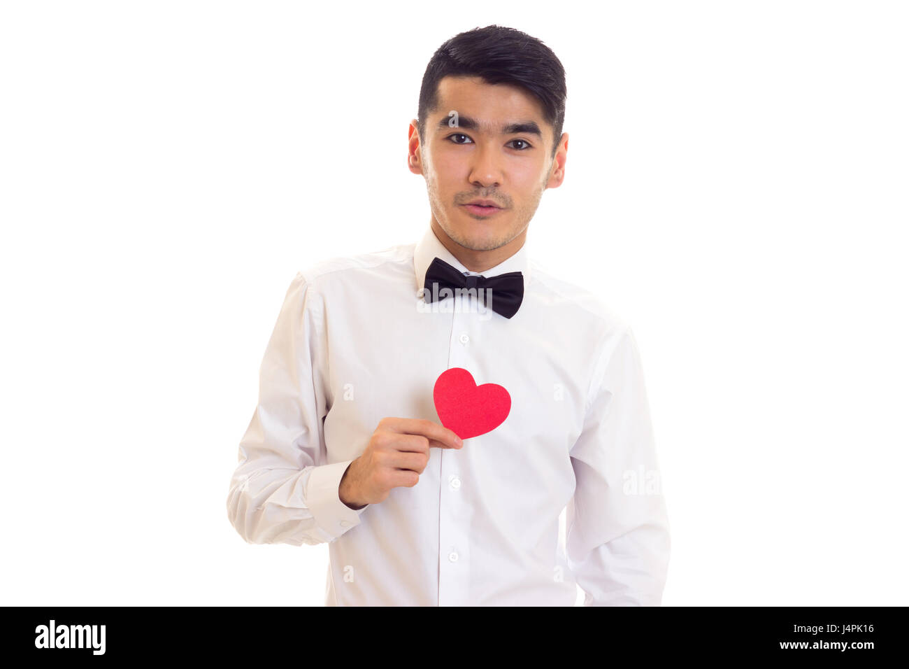 Young man holding a read heart Stock Photo - Alamy