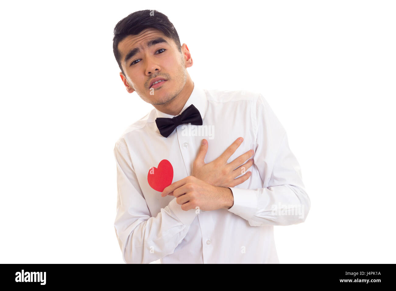 Young man holding a read heart Stock Photo - Alamy