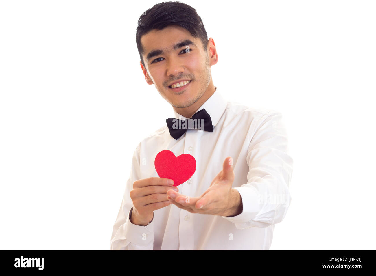 Young man holding a read heart Stock Photo - Alamy
