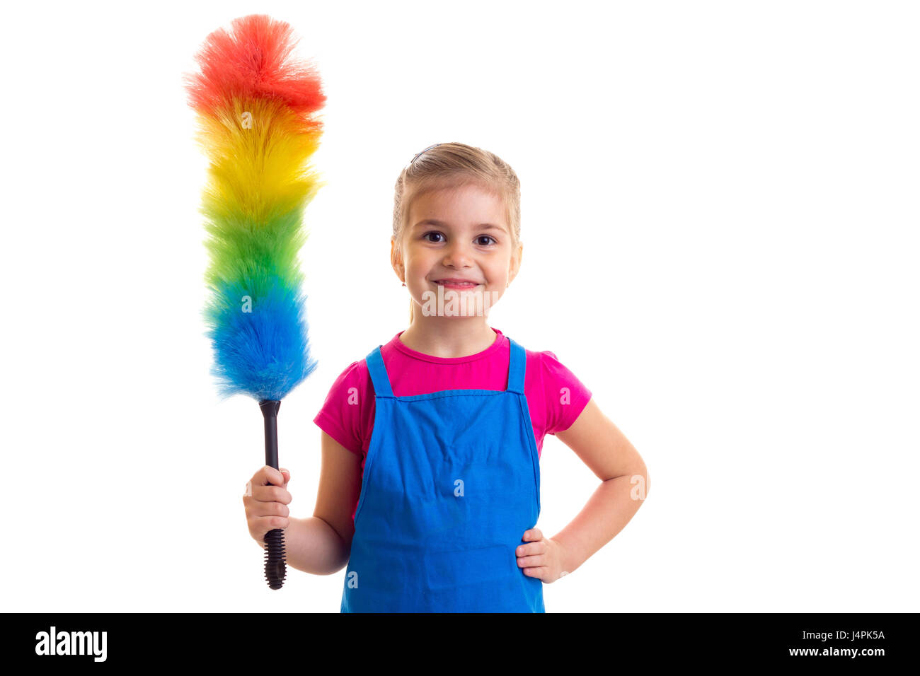 Girl in apron with duster Stock Photo - Alamy