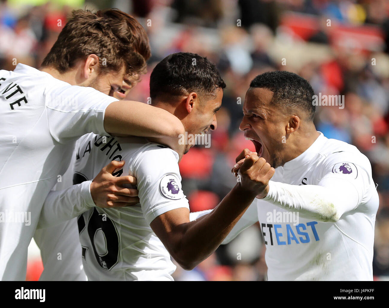 Swansea City's Kyle Naughton (centre)celebrates scoring his side's ...