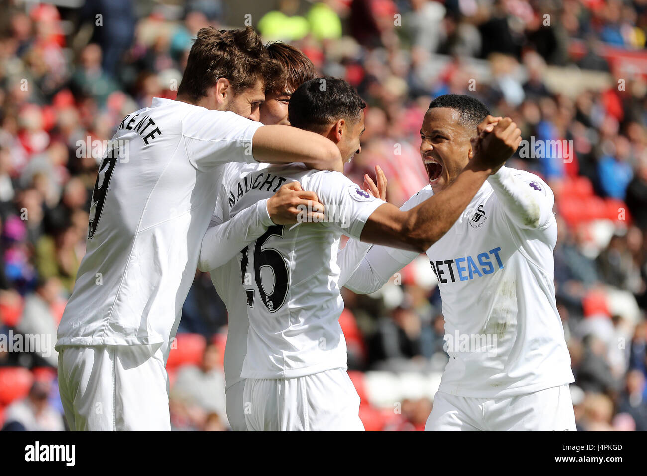 Swansea City's Kyle Naughton (centre) celebrates scoring his side's ...