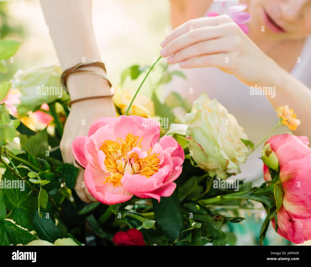 bouquet, holidays, people and floral arrangement concept - close up on ...