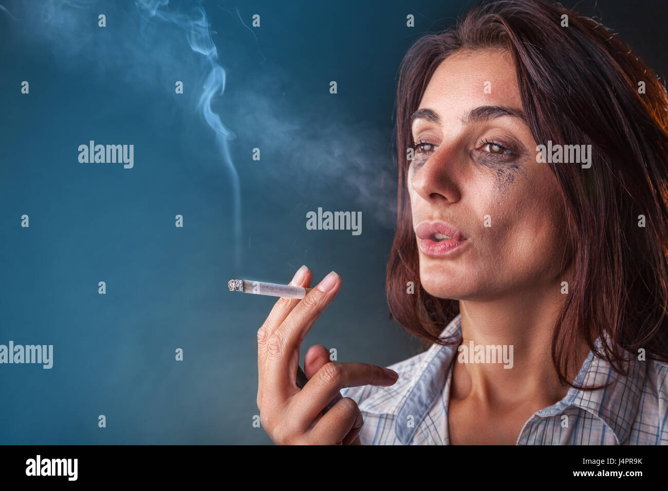 Crying woman with cigarette hi-res stock photography and images - Alamy