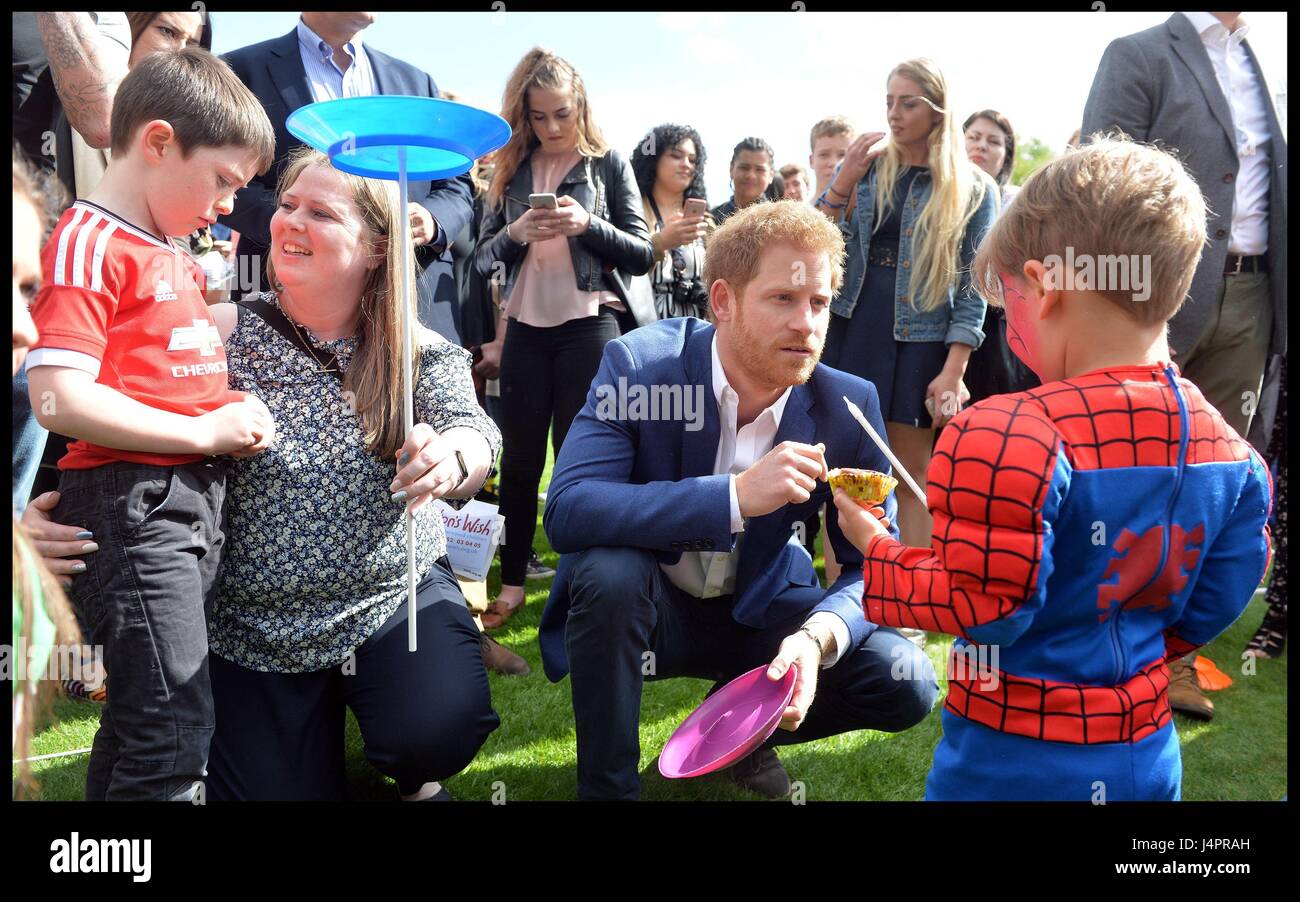 Prince Harry plays with George Hinchliffe, 3 (in spiderman outfit) with ...