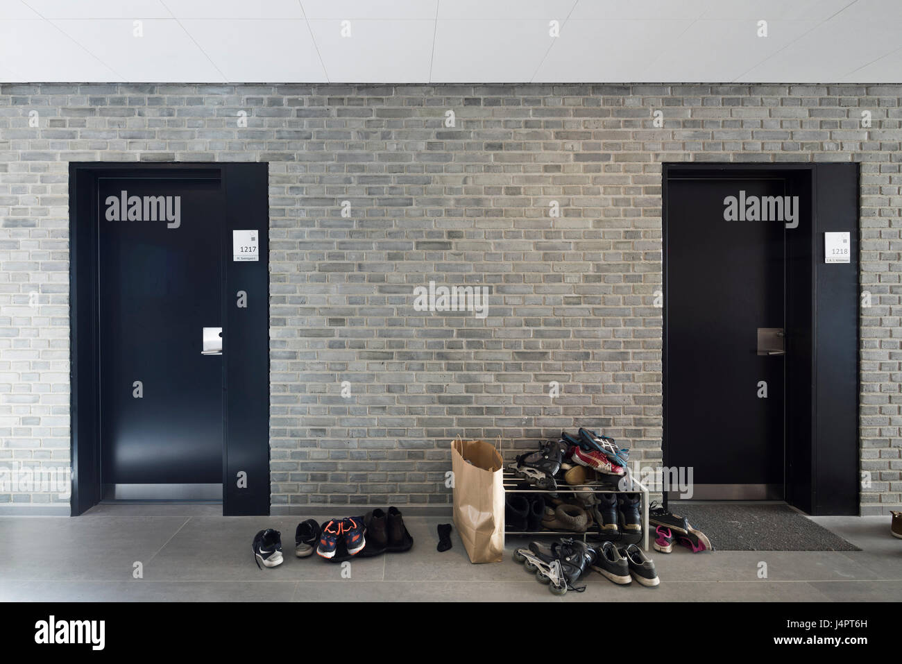 Doors to student bedrooms with shoe storage. Campus Hall University of ...