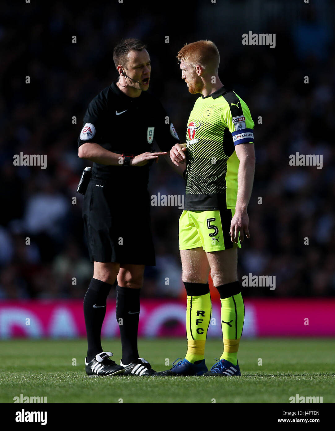 Refereeâ€™s Stuart Atwell speaks with Readingâ€™s Paul McShane during ...