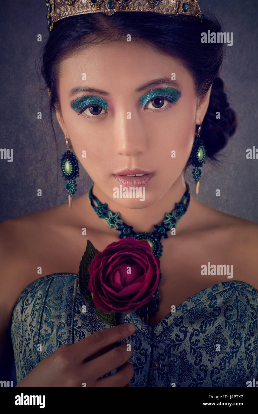 Beautiful woman with rose Stock Photo - Alamy