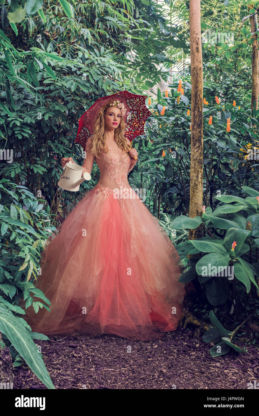 Beaitiful gardener in pink tulle dress Stock Photo - Alamy