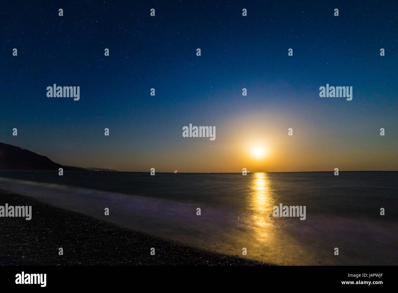 Beautiful night seascape with moonlight and stars Stock Photo - Alamy