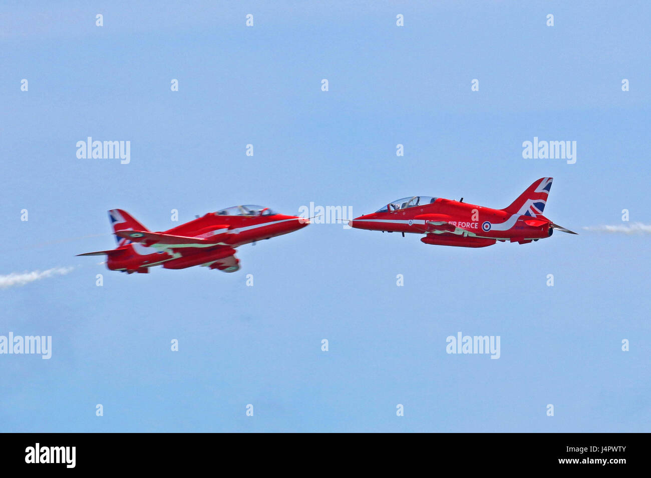 Red arrows hawk aircraft very close crossover Stock Photo - Alamy