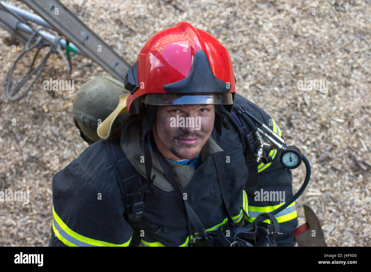 Portrait of a fireman top view from stage Stock Photo - Alamy