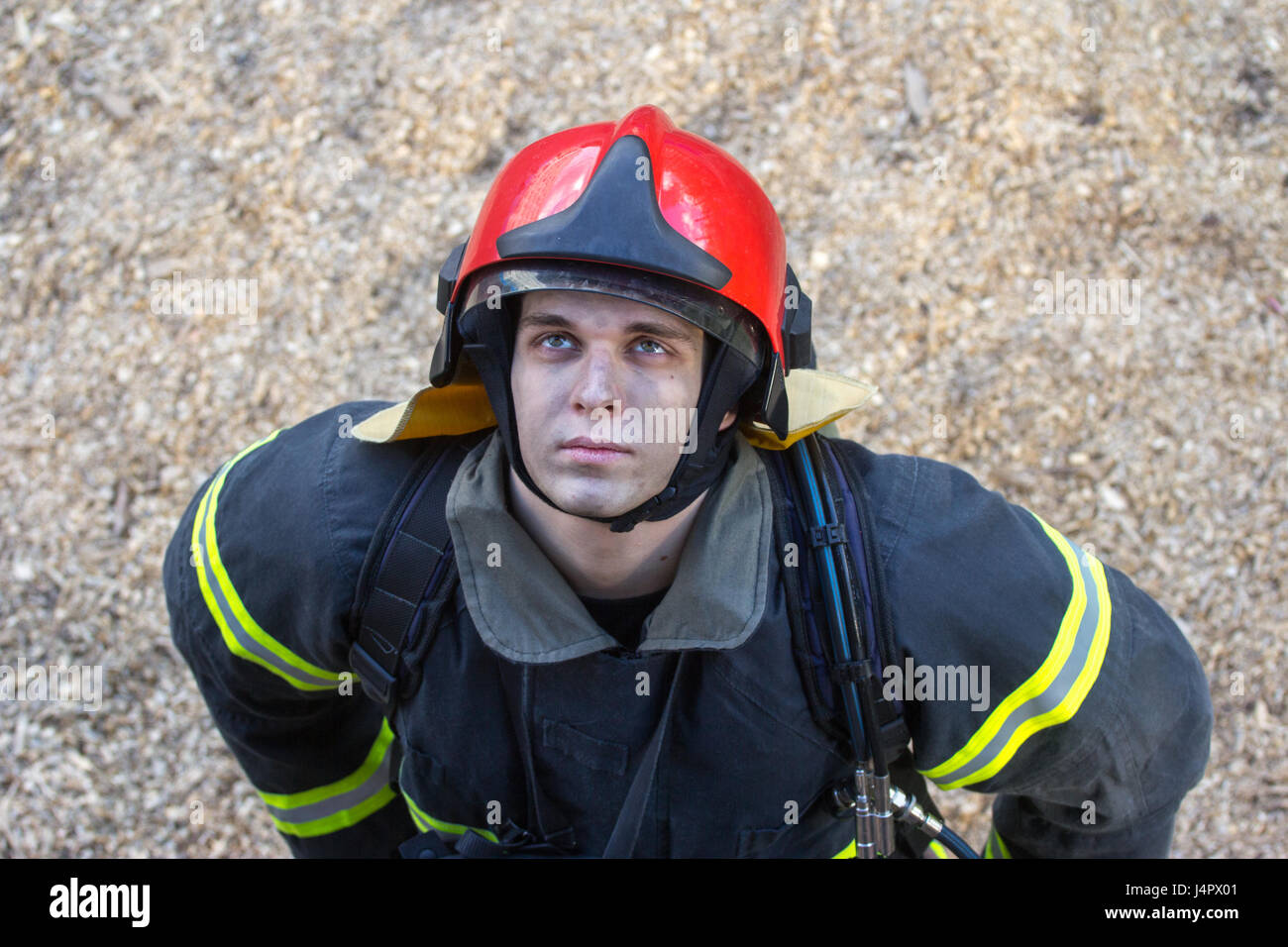Portrait of a fireman top view from stage Stock Photo - Alamy