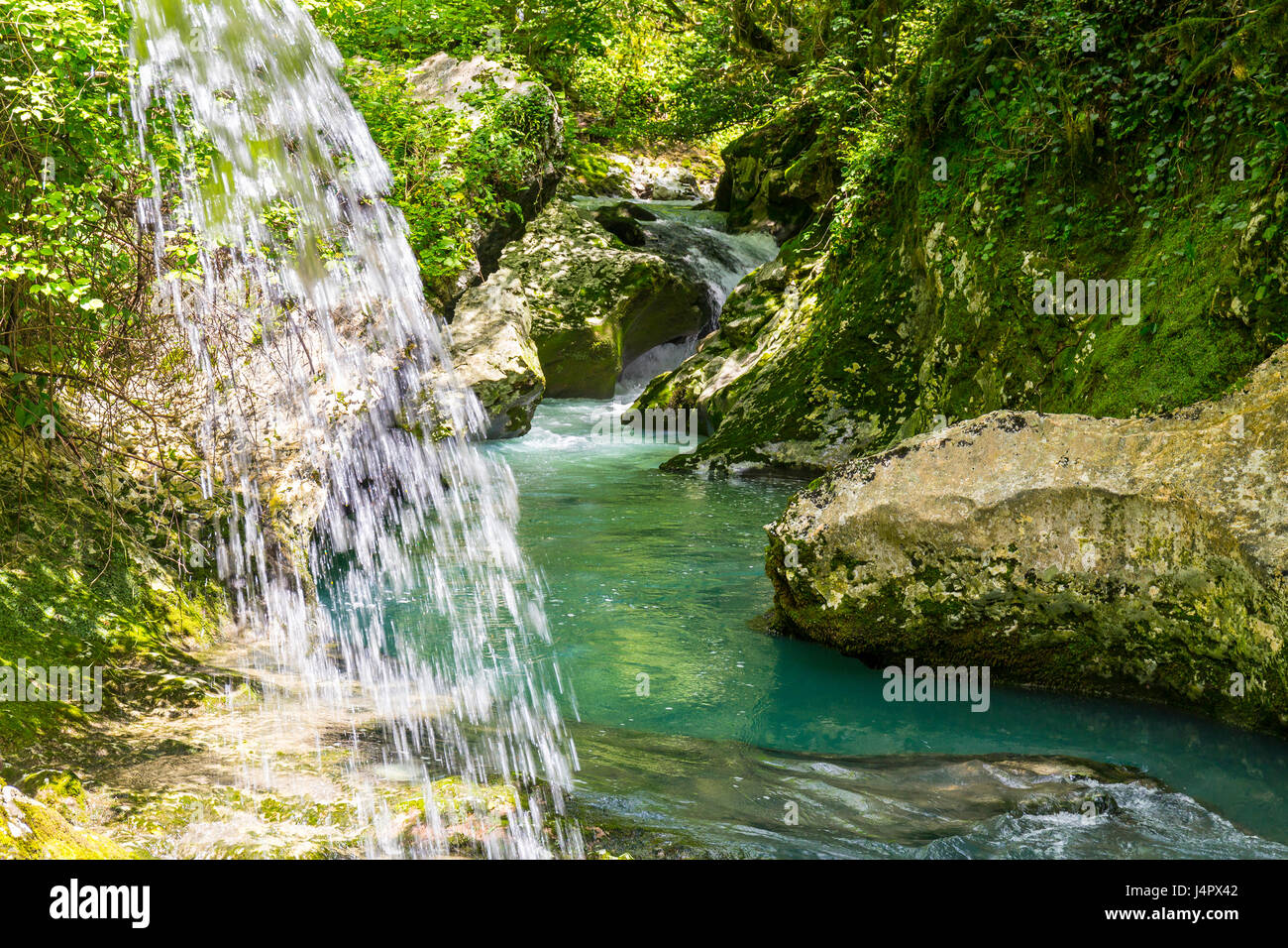 Close up view on falling water on mountain river background Stock Photo ...