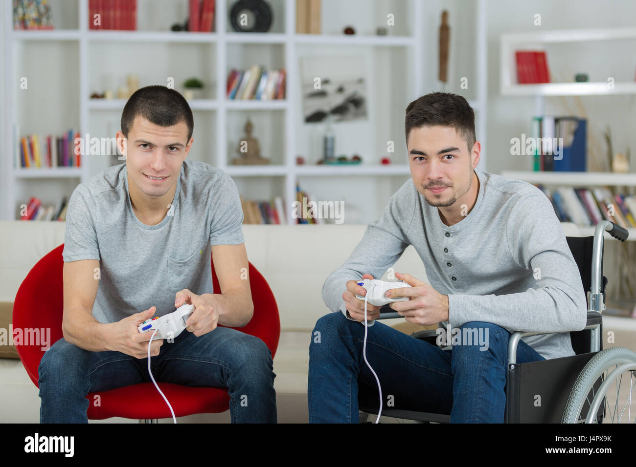 friends playing video game Stock Photo - Alamy