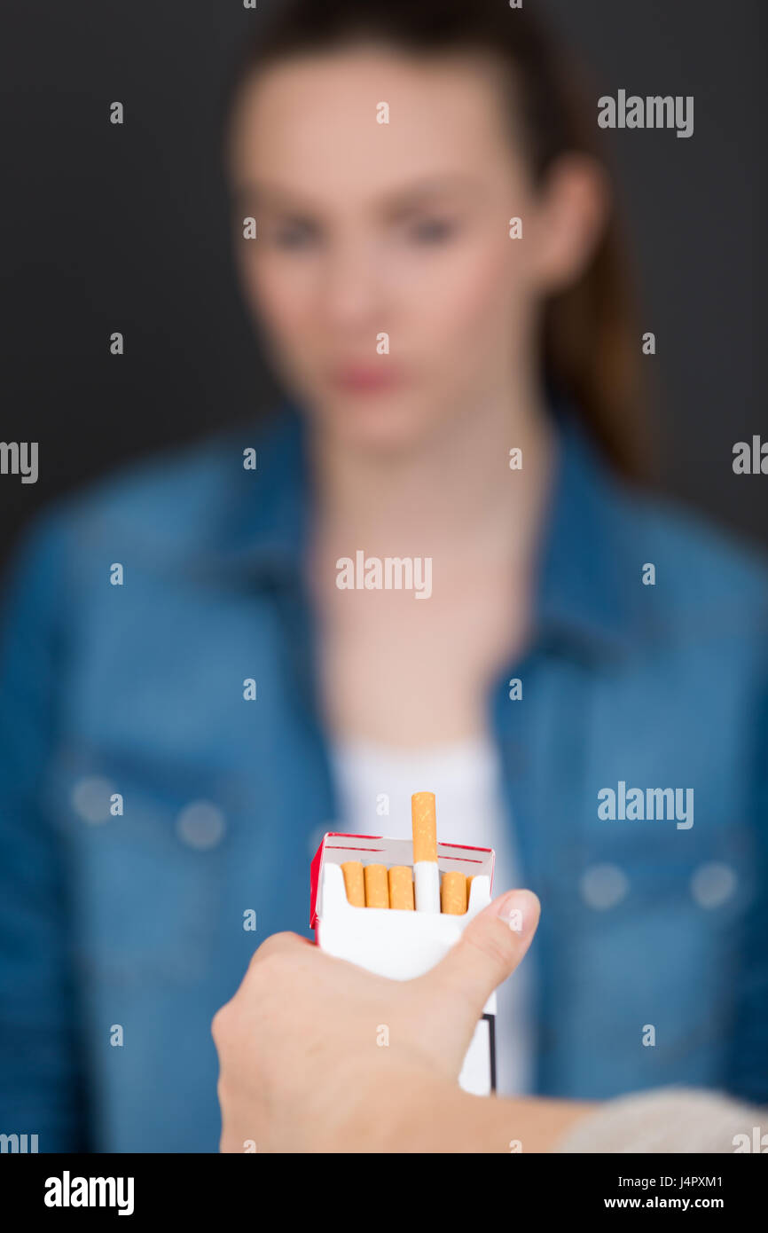 offering a cigarette Stock Photo - Alamy