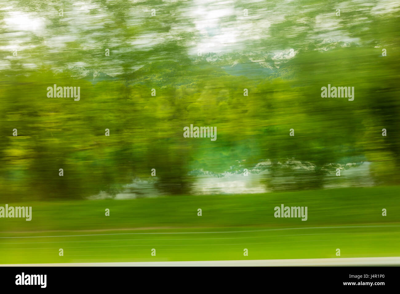 Green natural blurred motion natural green background Stock Photo - Alamy