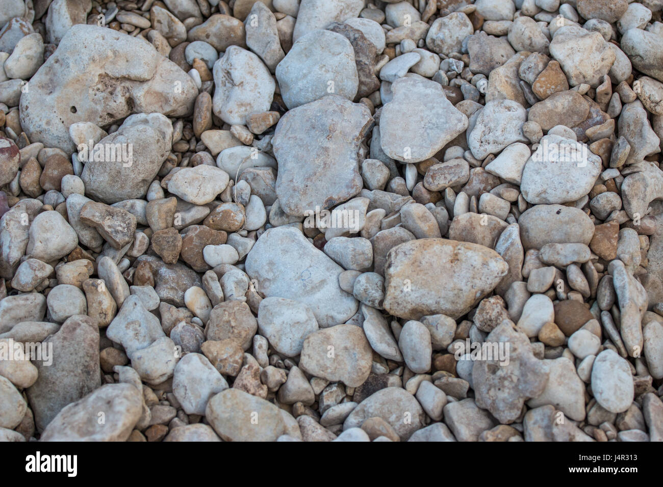 Looking down at rocks of various sizes Stock Photo - Alamy