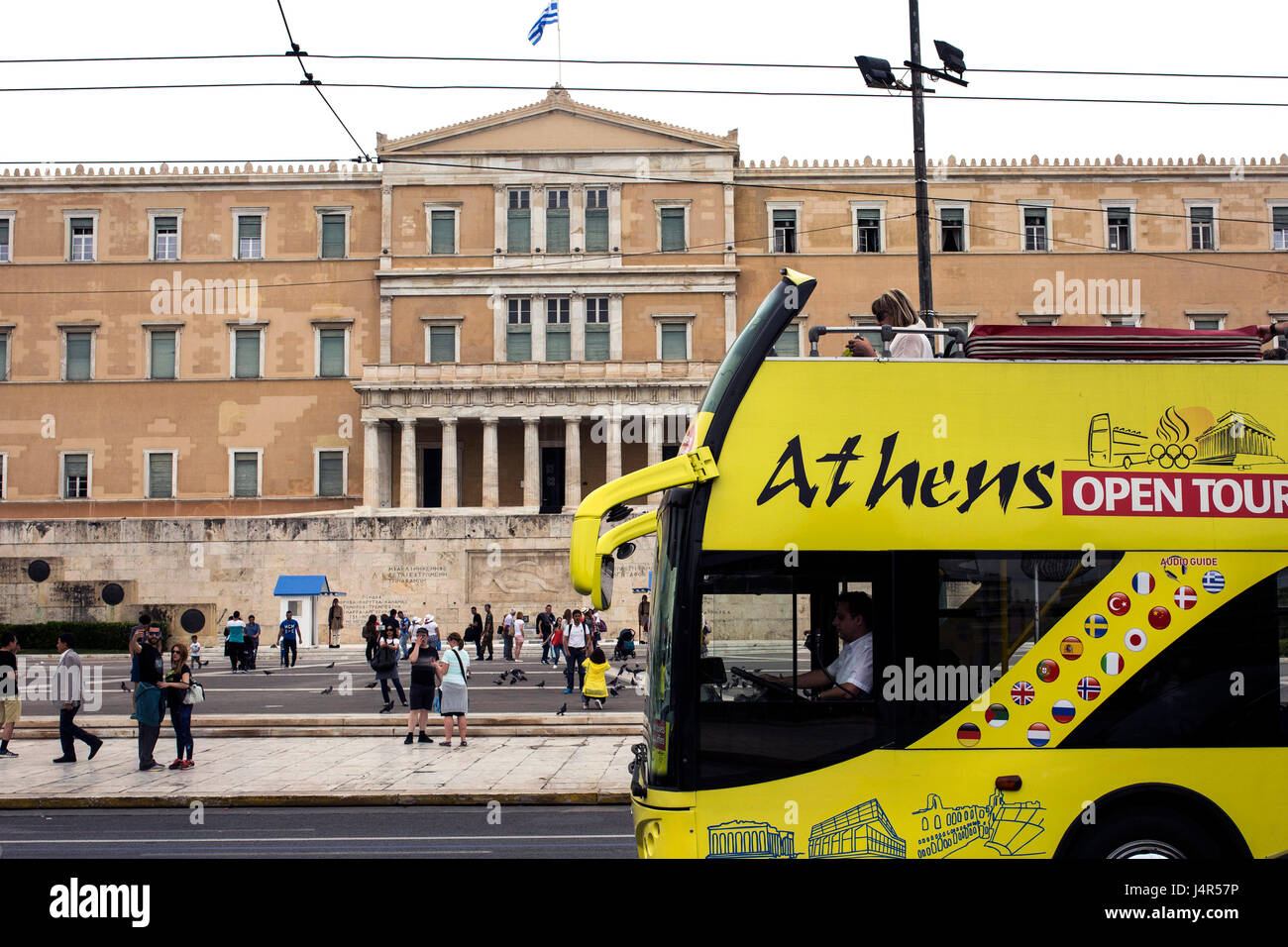 Athens, Greece. 12th May, 2017. A tourist bus pass outside the Greek ...