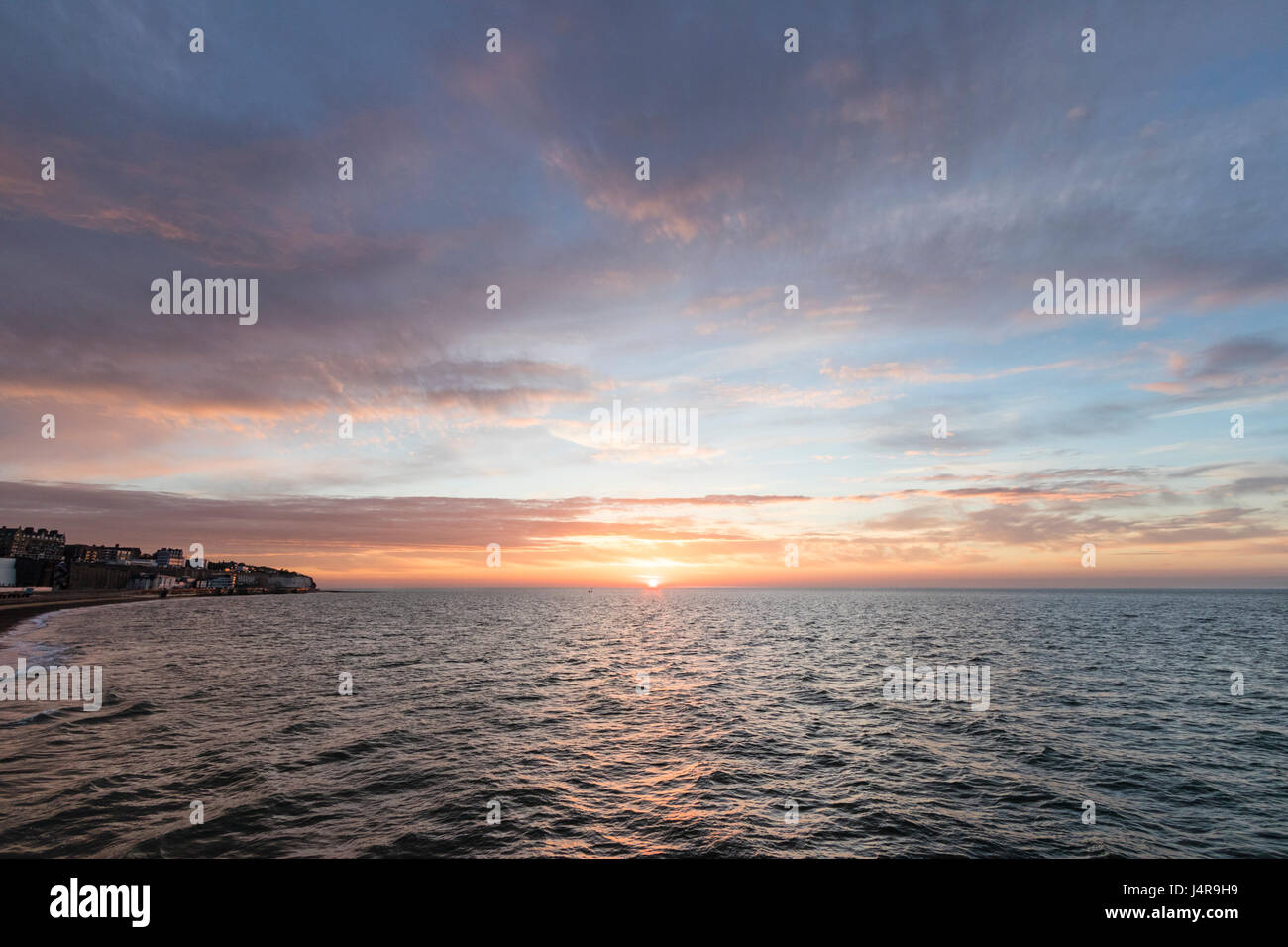 England, Ramsgate. Sunrise and dawn sky over the Thanet offshore wind ...