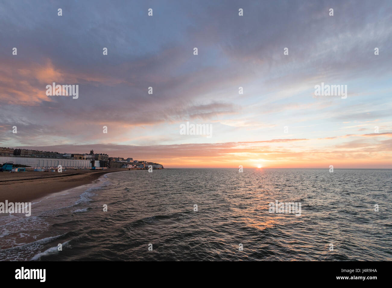 England, Ramsgate. Sunrise and dawn sky over the Thanet offshore wind ...
