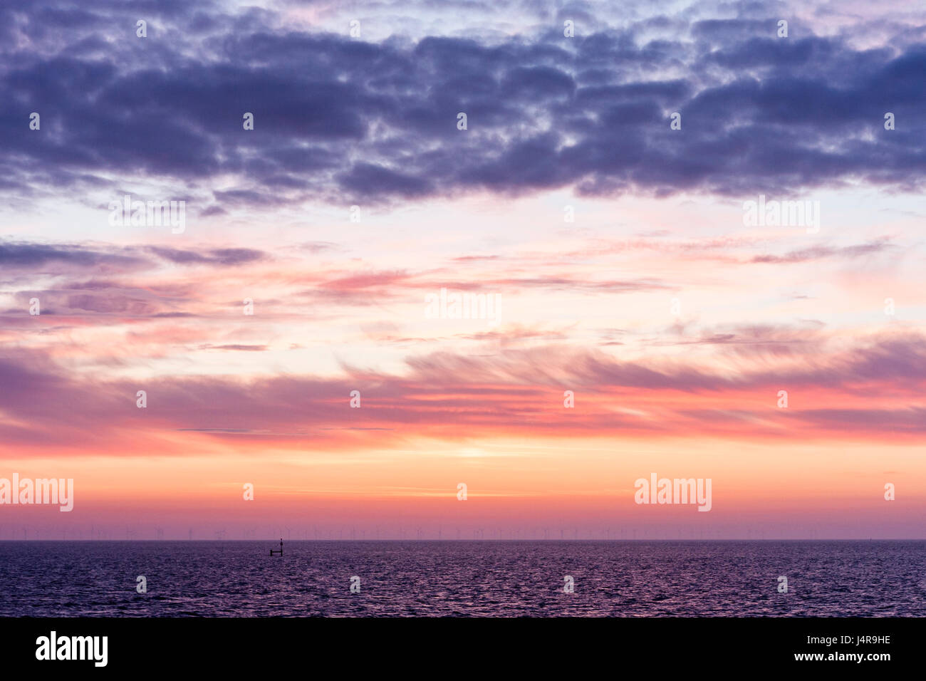 England, Ramsgate. Dawn sky over the Thanet offshore wind farm on the ...