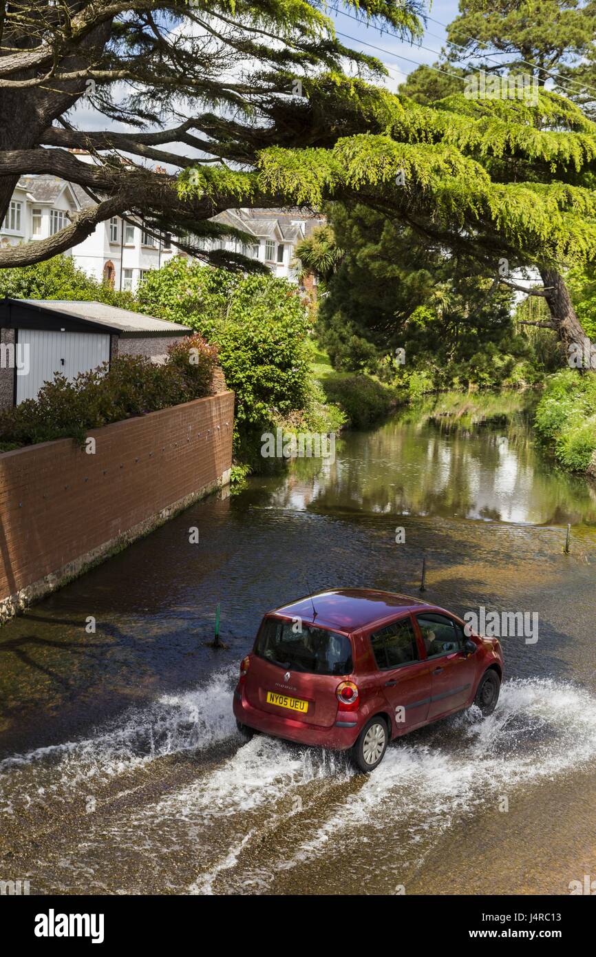 Sidmouth, Devon 14th May 17 Cars cross through the ford on the River ...