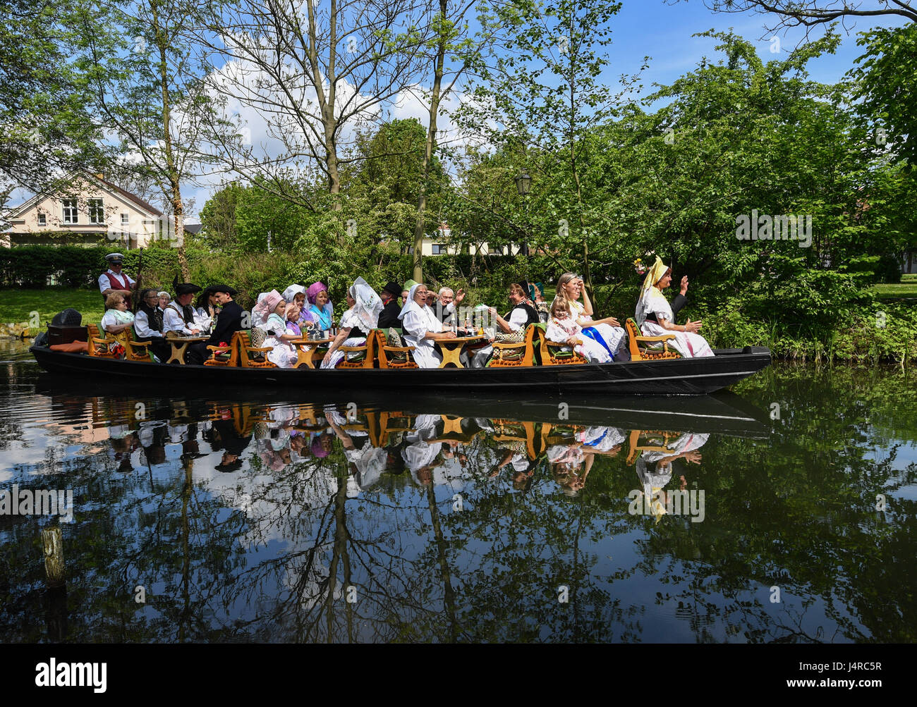 Luebben, Germany. 14th May, 2017. People in traditional costumes ride a ...
