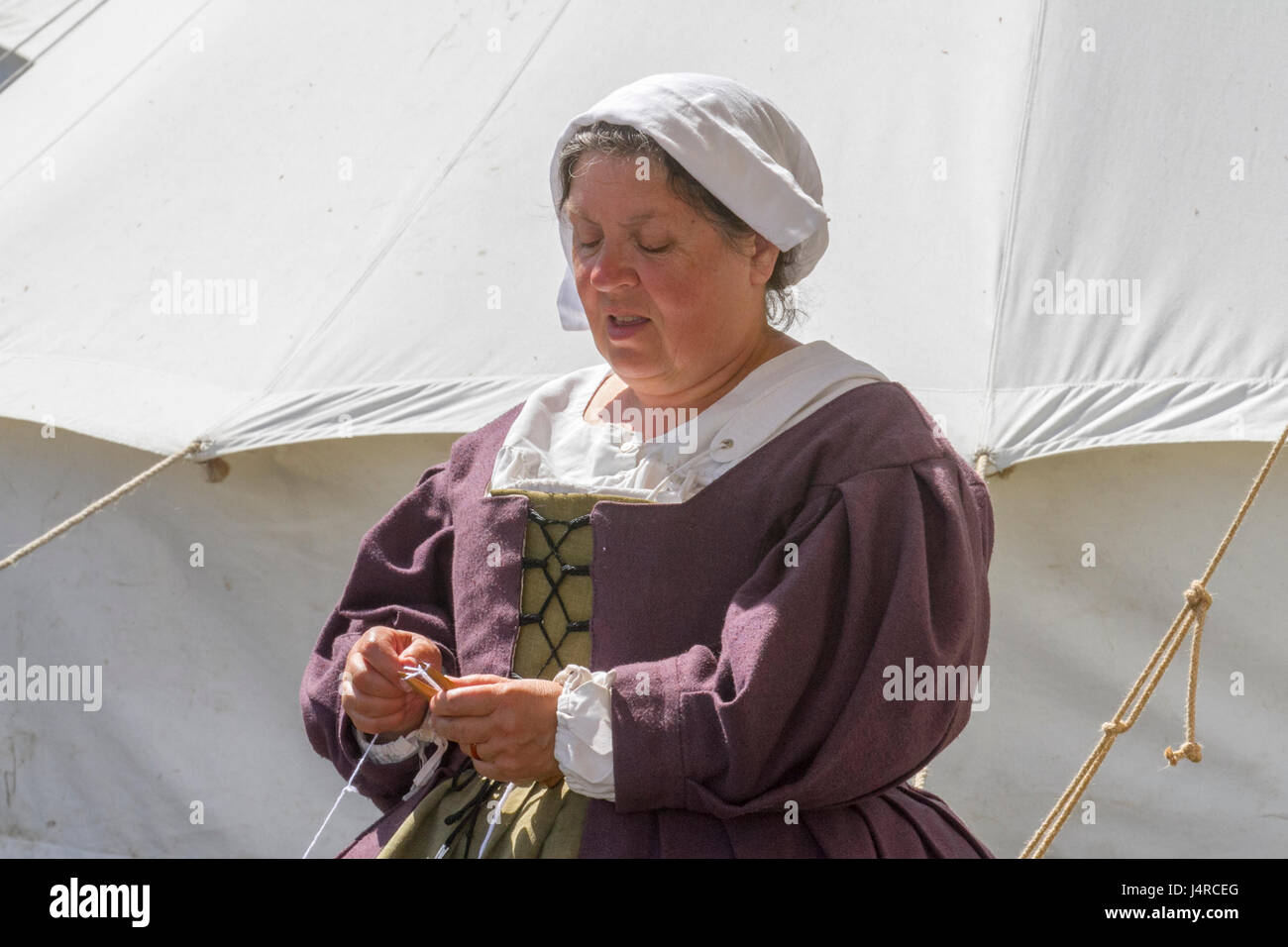 medieval reenactor woman female seamstress clothes clothing repairs ...