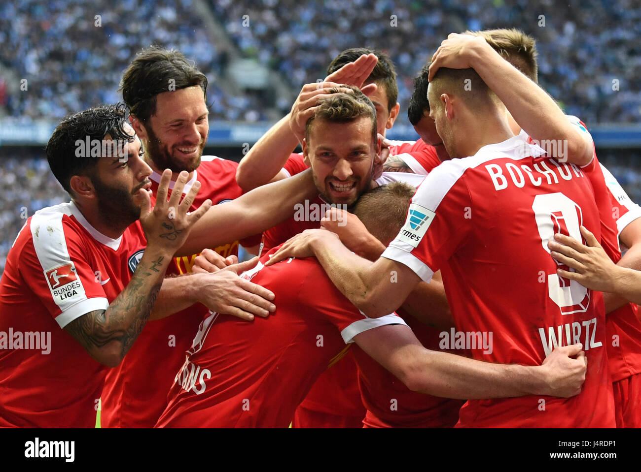 Munich, Germany. 14th May, 2017. Bochum's Tom Weilandt (c) celebrates ...