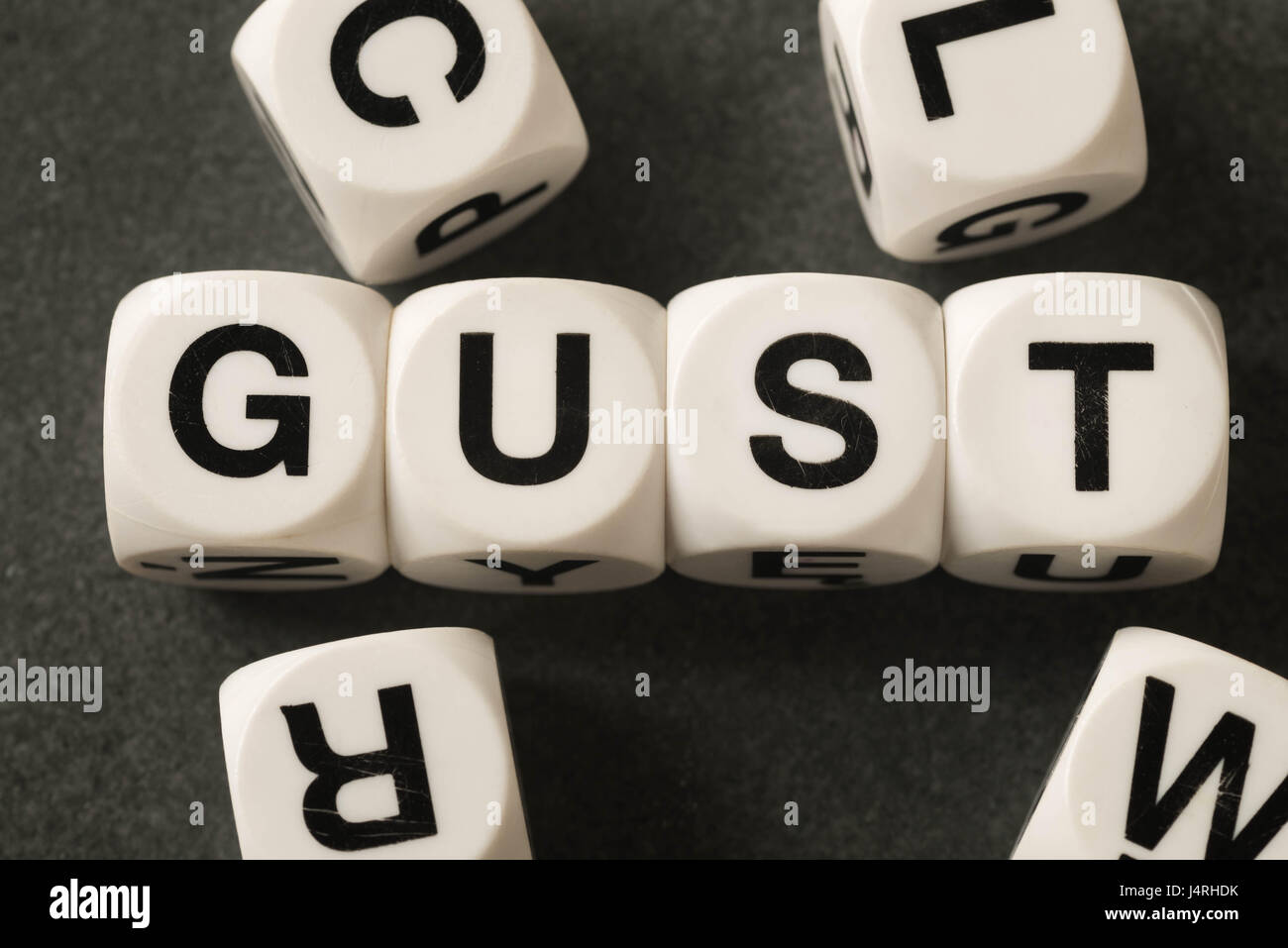 word gust on white toy cubes Stock Photo - Alamy