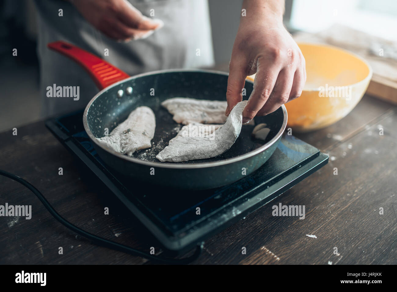 Hand cutting sea bass fillet hi-res stock photography and images - Alamy