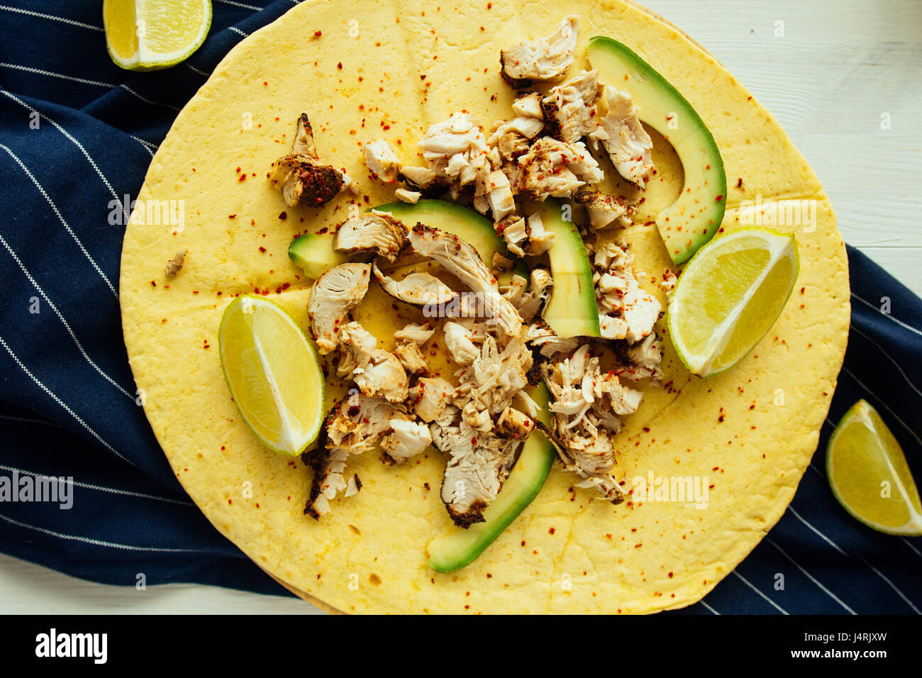 Tortilla with chicken, avocado and lime top view selective focus Stock ...